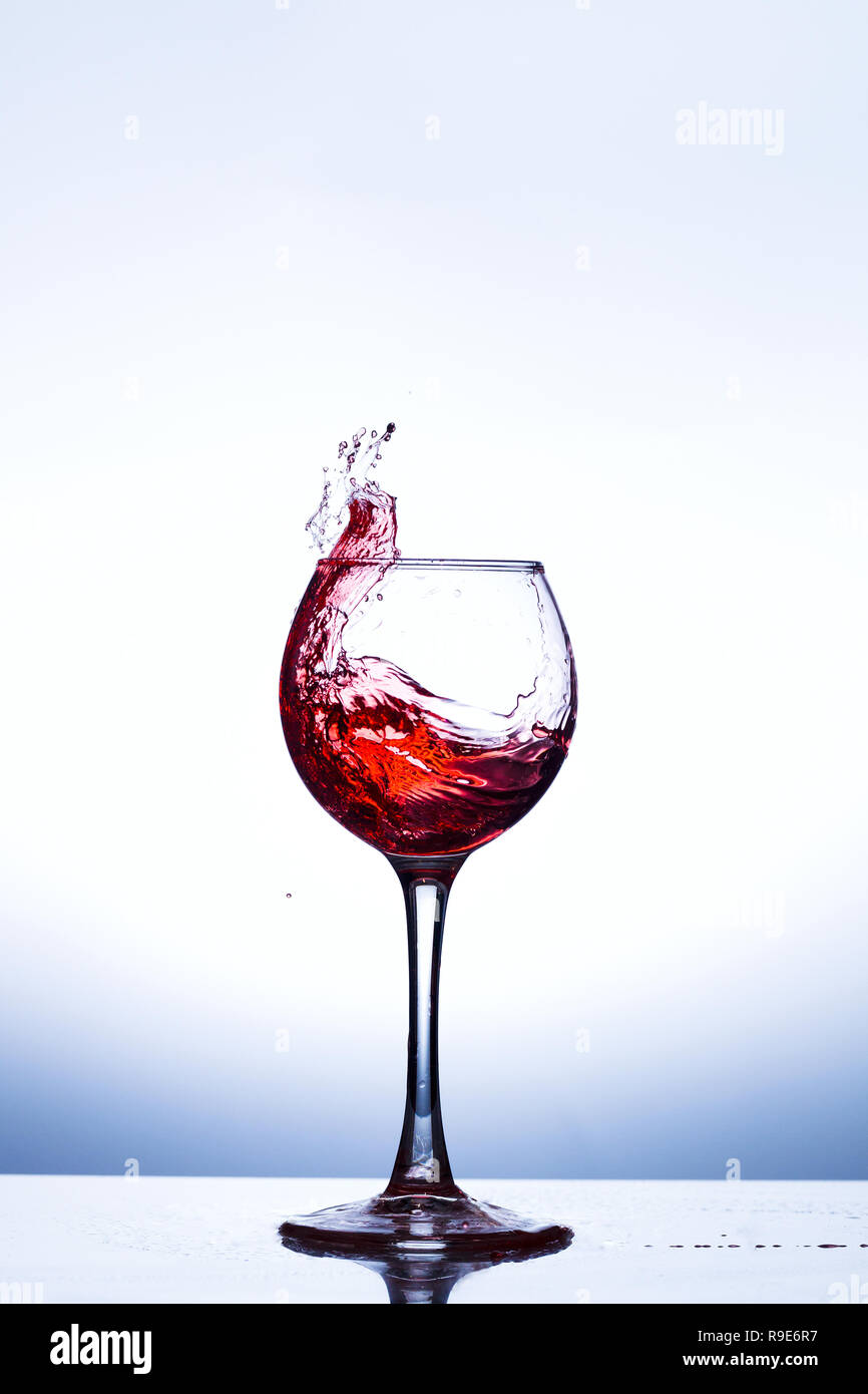 Wine splashing in glass, acrylic background, studio lighting Stock ...