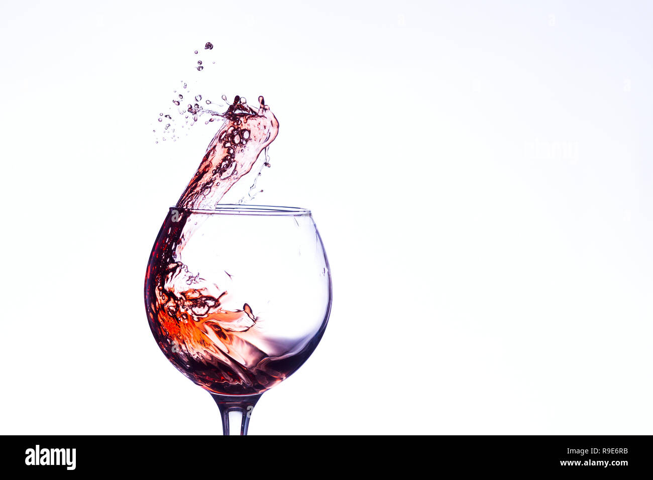 Wine splashing in glass, acrylic background, studio lighting Stock ...