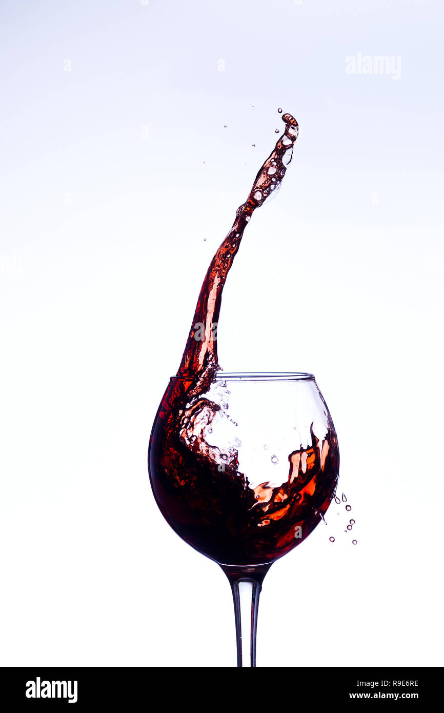 Wine splashing in glass, acrylic background, studio lighting Stock ...