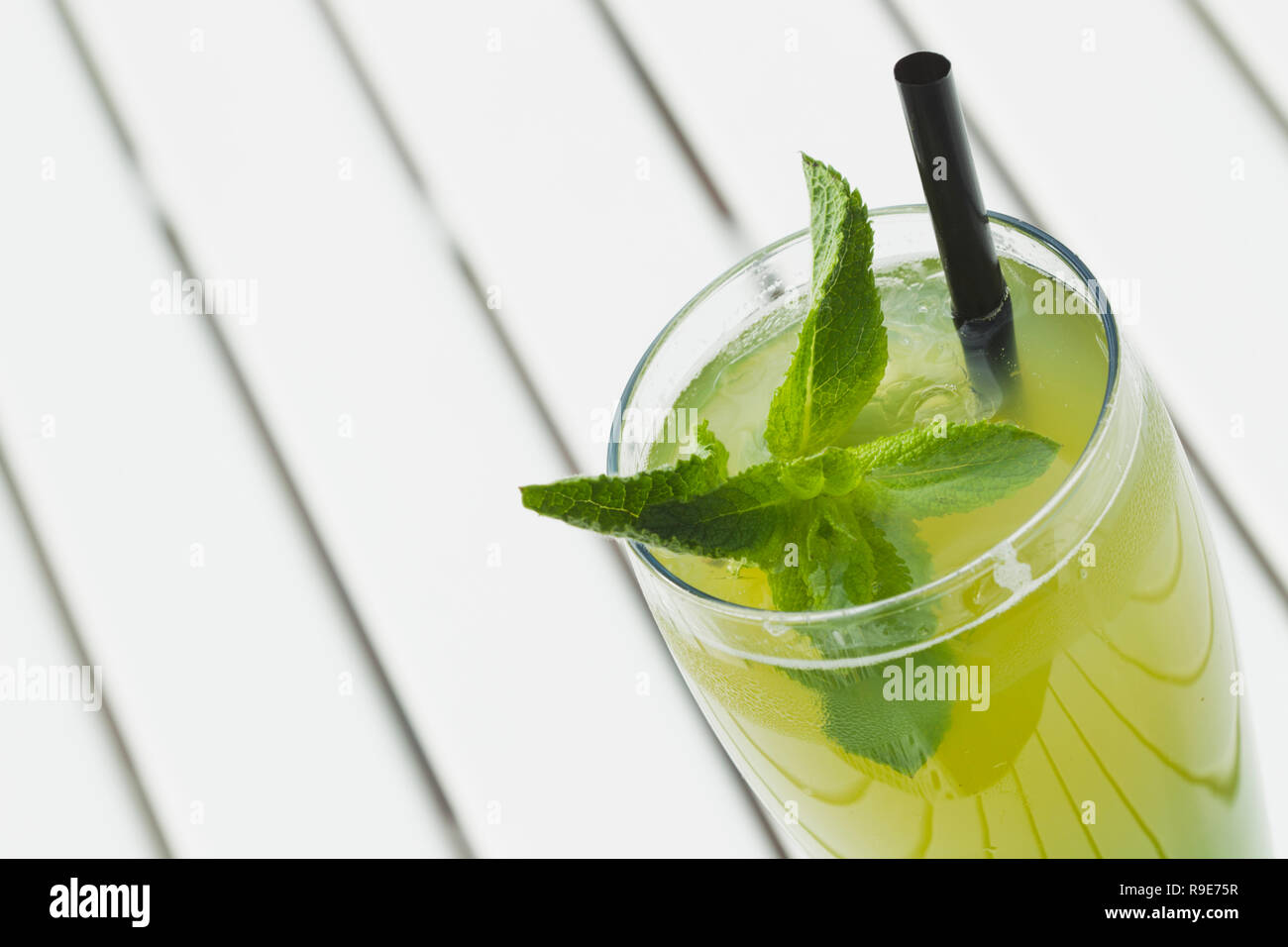 The cold lemonade with mint and ice on the outdoor veranda summer day ...