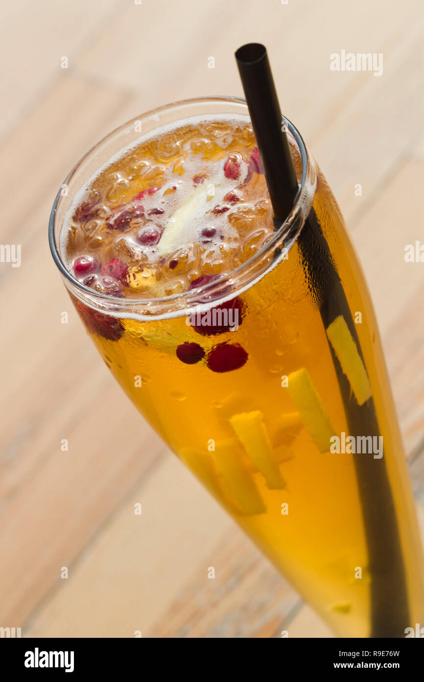 Cold lemonade with cranberries, ginger and ice on the outdoor veranda ...