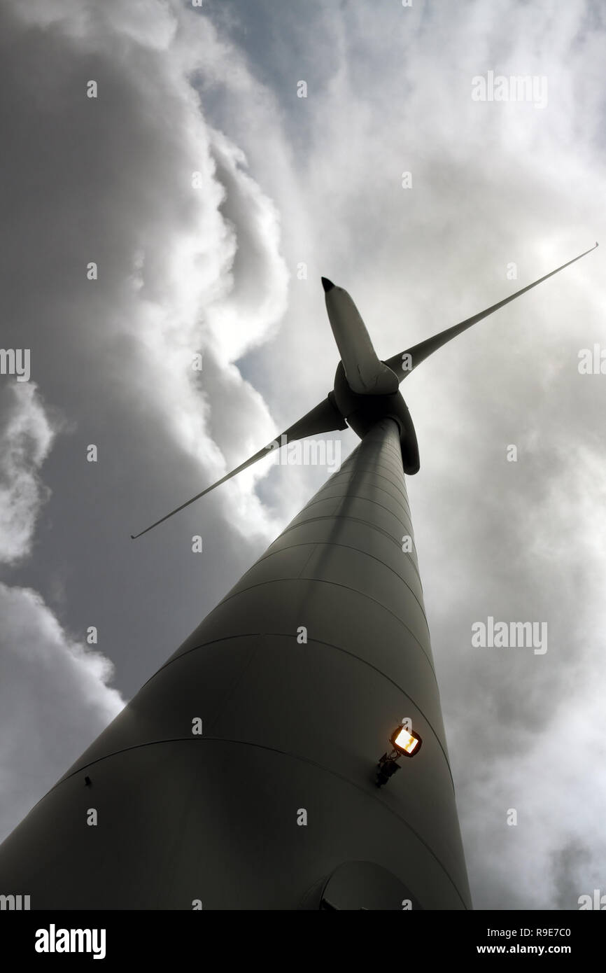 Wind turbine on top of a mountain in the middle of clouds Stock Photo ...