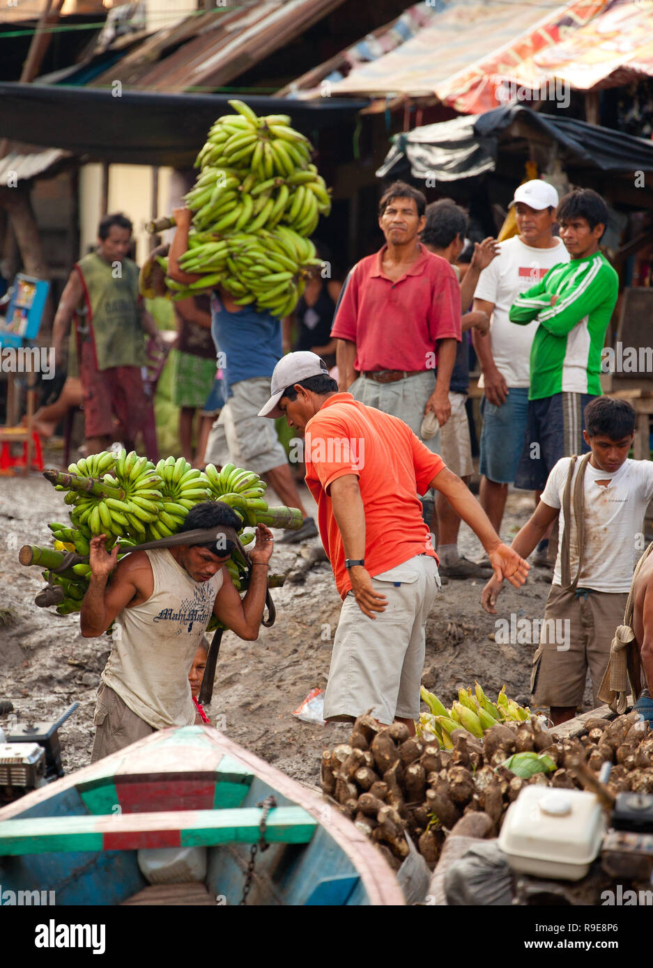 People carrying bananas and other commodities at Belen in Peru Stock ...