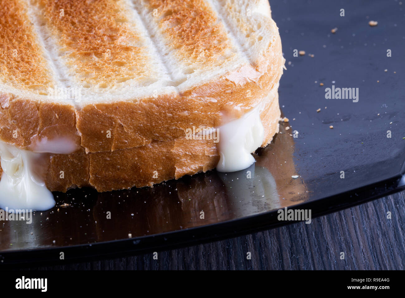 Toast with melting cheese, close up, horizontal image Stock Photo - Alamy