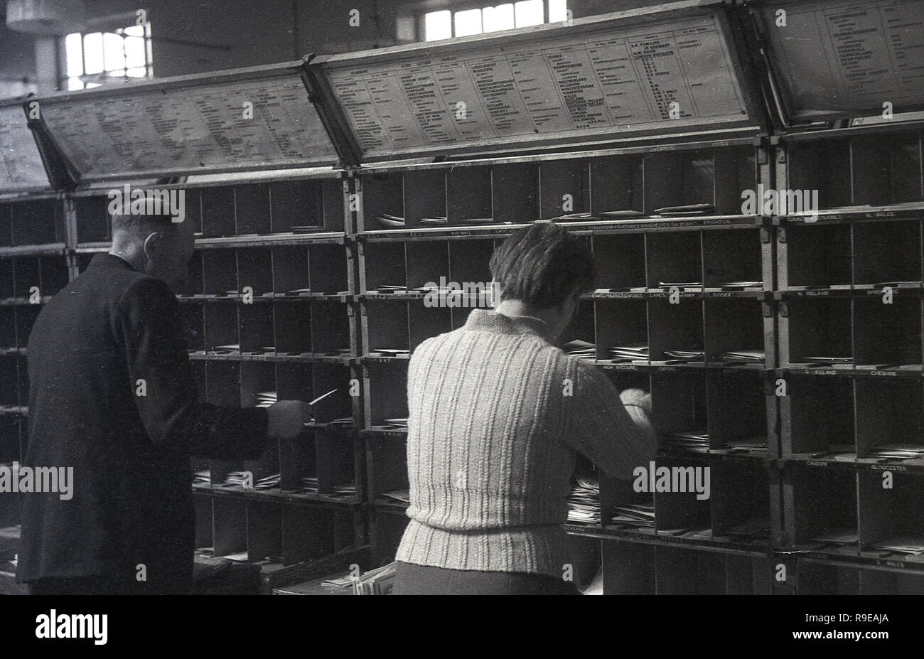 1948, historical, two General Post Office (GPO) staff working inside a ...