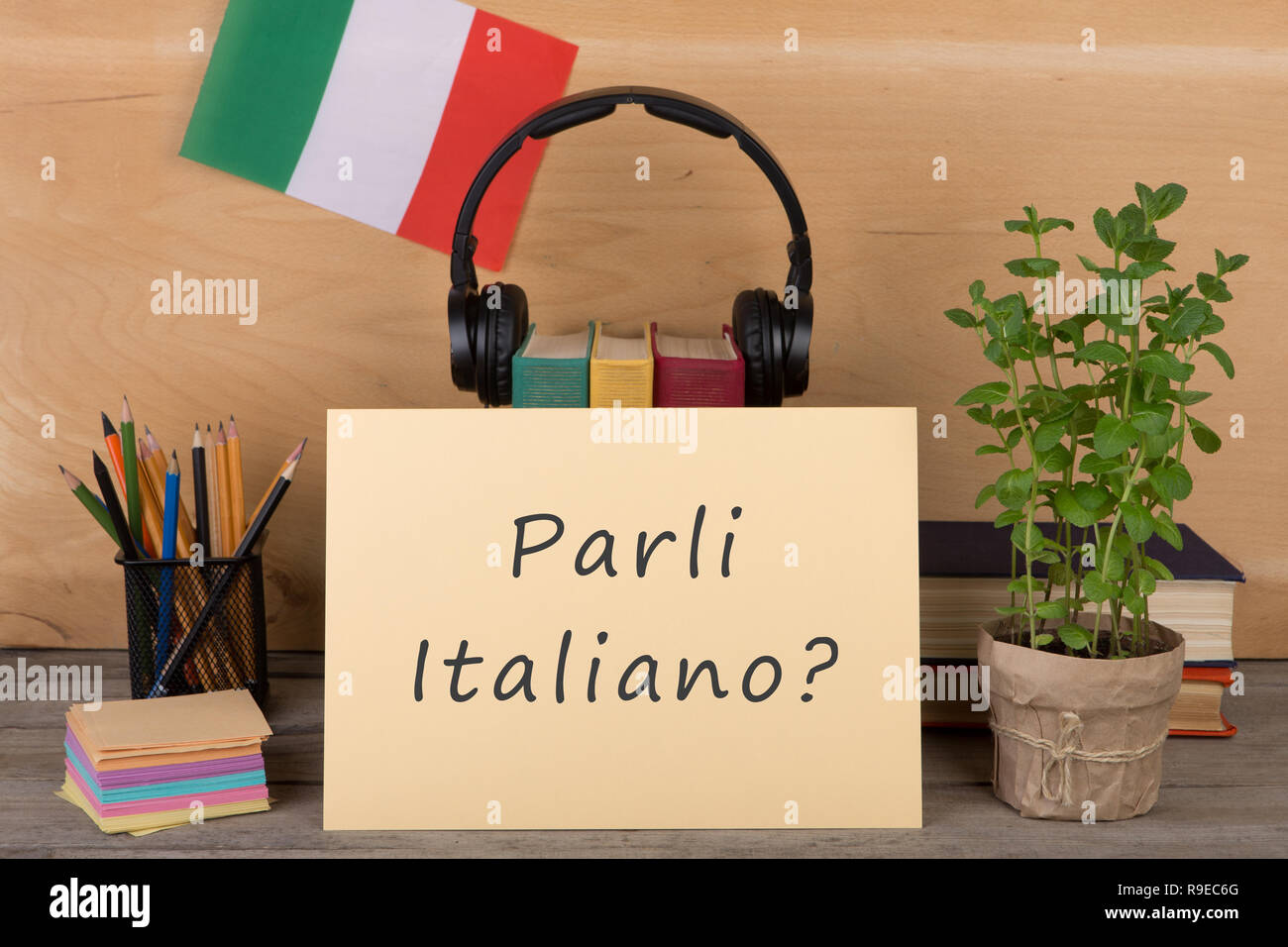 Learning languages concept - paper with text "parli italiano?", flag of ...