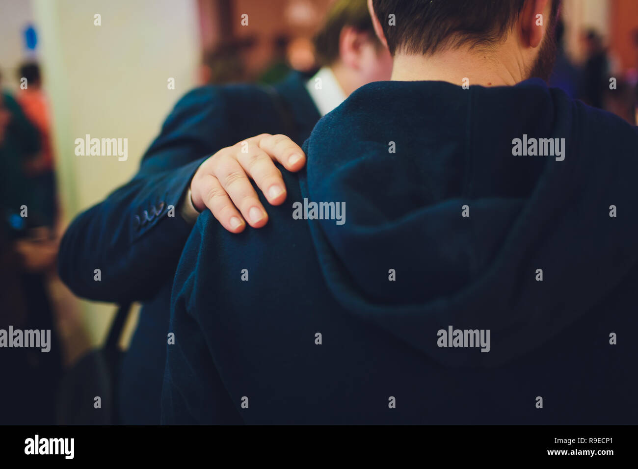 Man hand on womans shoulder hi-res stock photography and images - Alamy