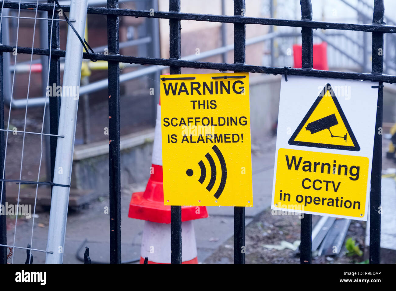 Scaffolding is alarmed warning CCTV operation sign at construction ...