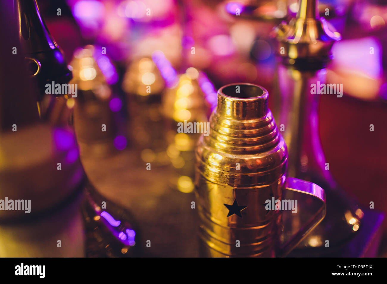 Hookah hot coals on shisha bowl with black background. Stylish oriental ...