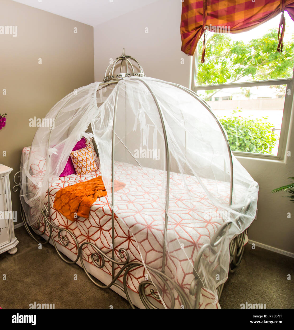 Child's Bed With Frame And Mesh Netting Stock Photo - Alamy