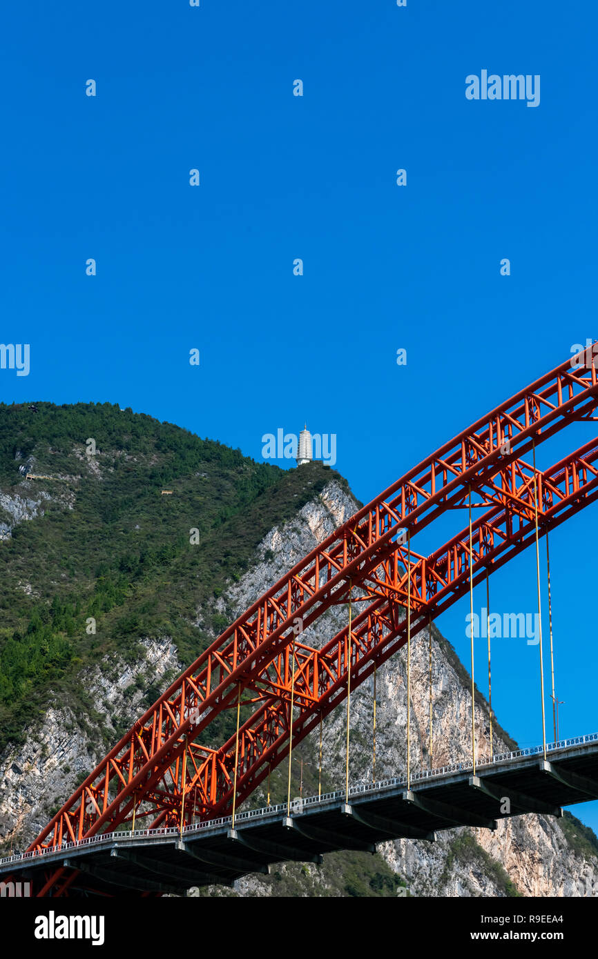 Wushan river bridge - partial view of span with white pagoda in distant ...