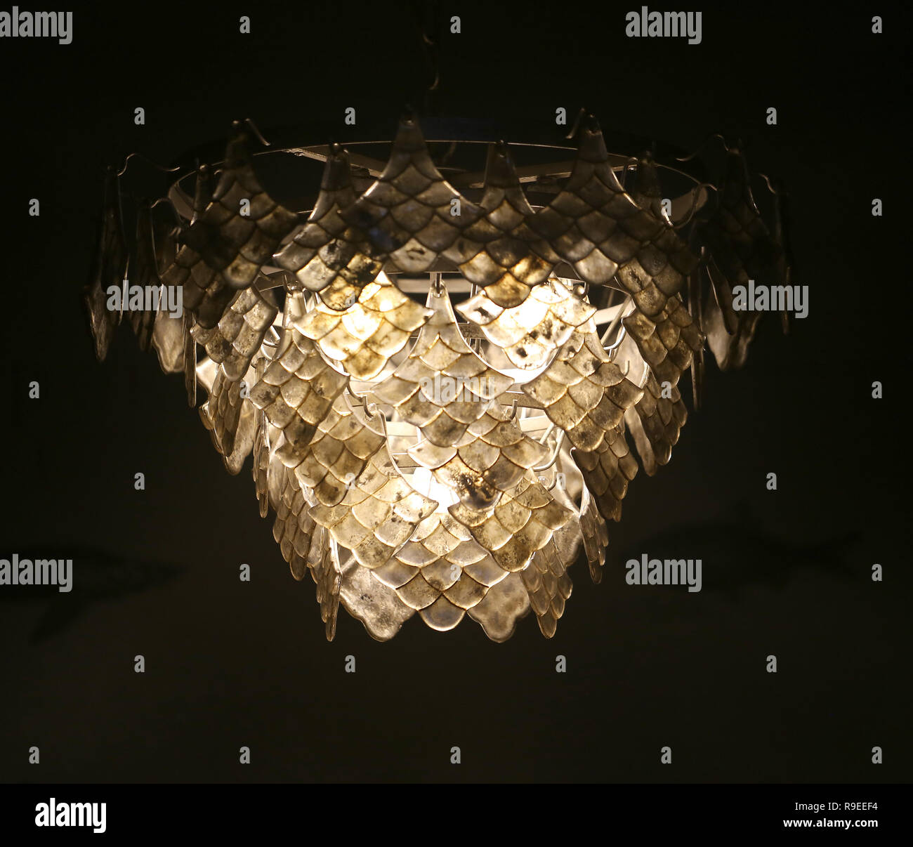 Macro photo of a beautiful fish scale chandelier in a restaurant Stock ...