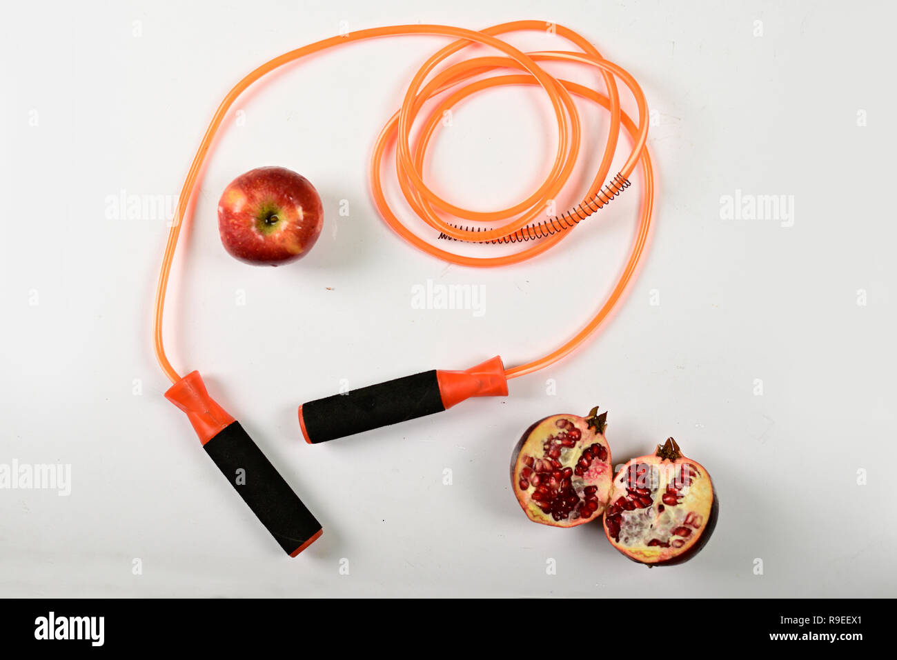 jumping rope and fruit isolated on white background Stock Photo - Alamy