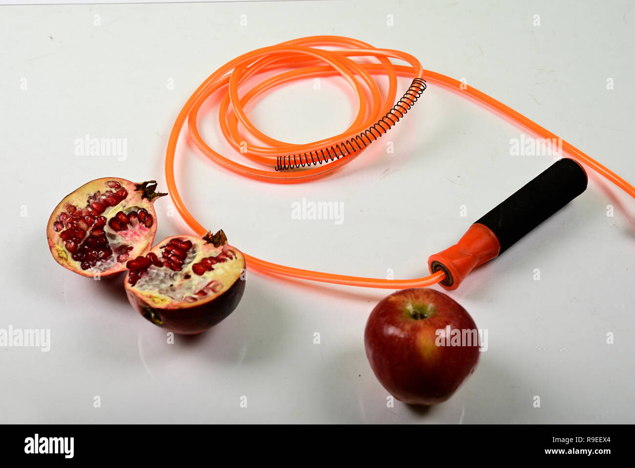 jumping rope and fruit isolated on white background Stock Photo - Alamy