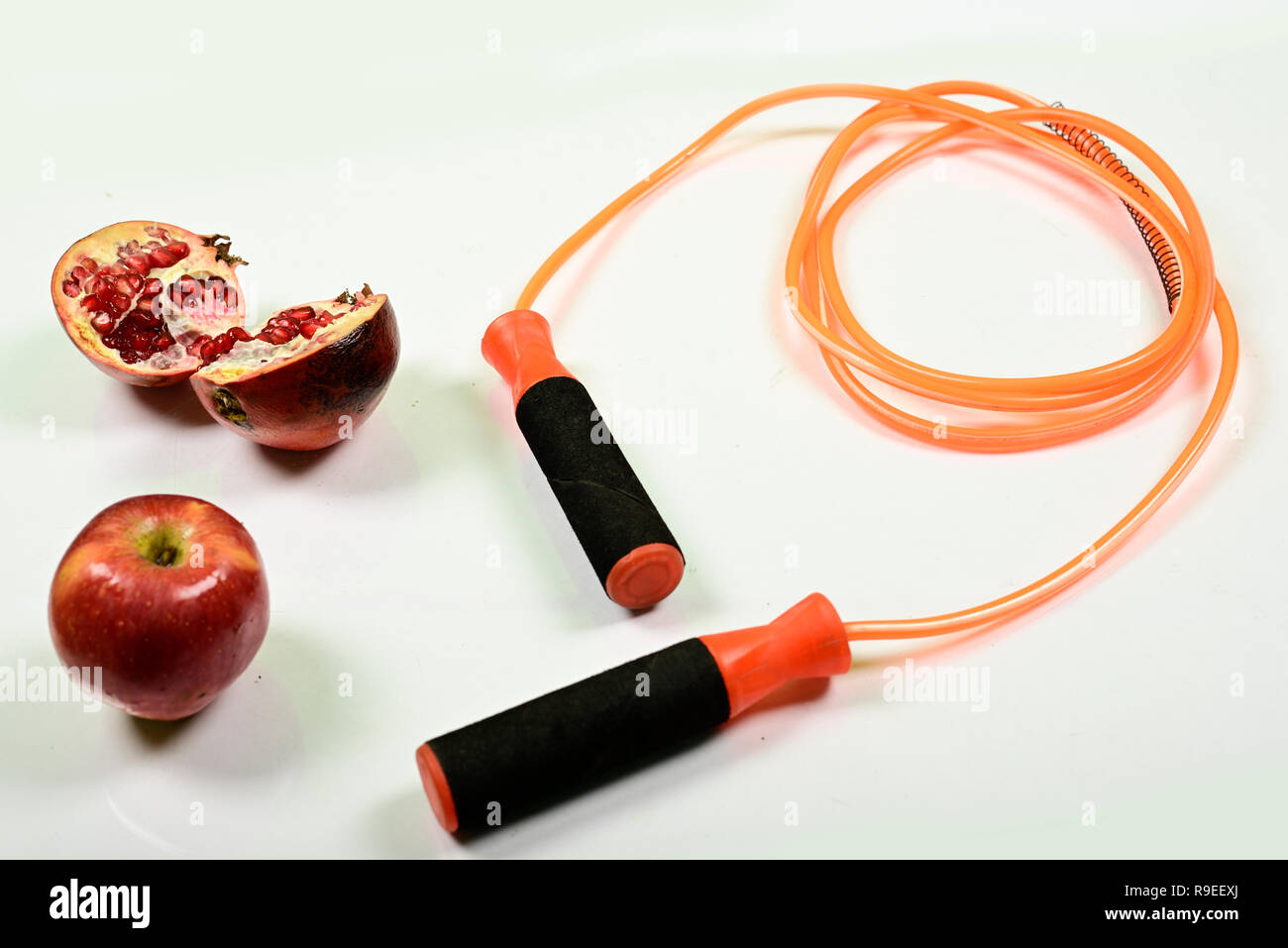 jumping rope and fruit isolated on white background Stock Photo - Alamy
