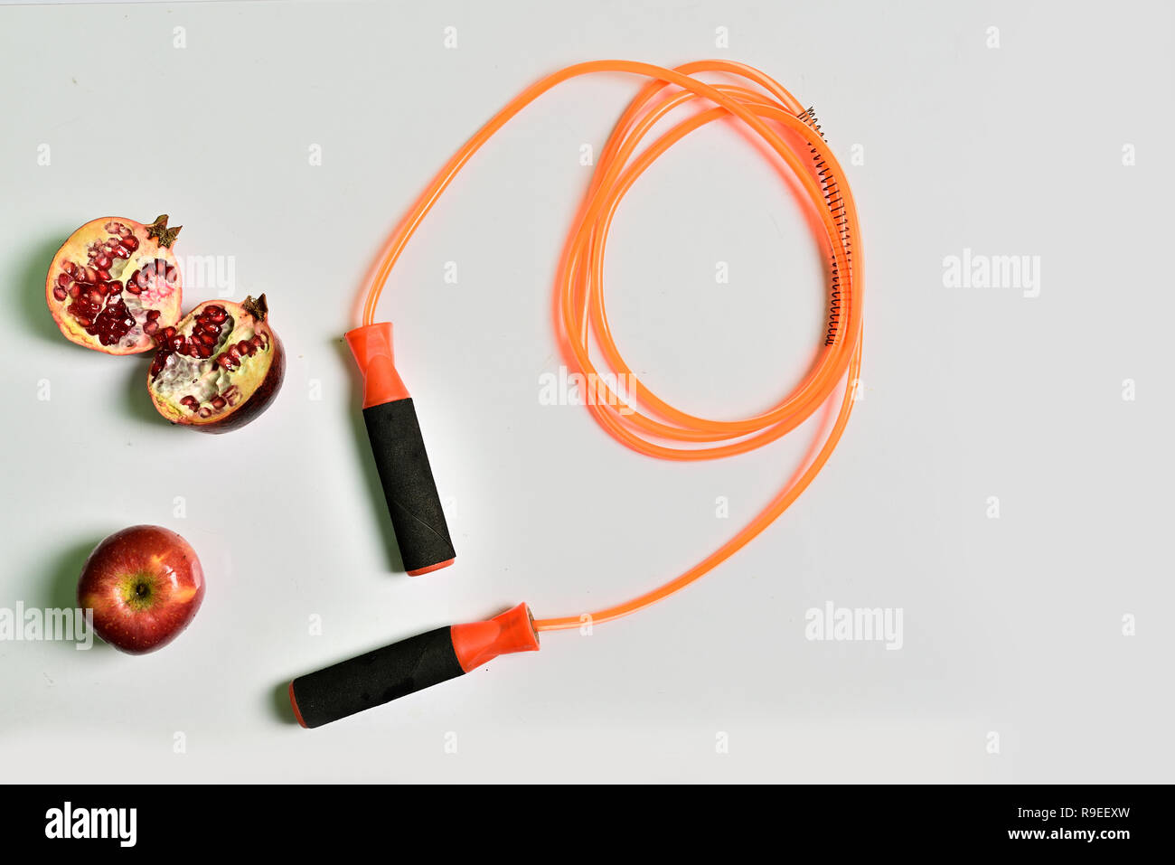 jumping rope and fruit isolated on white background Stock Photo - Alamy