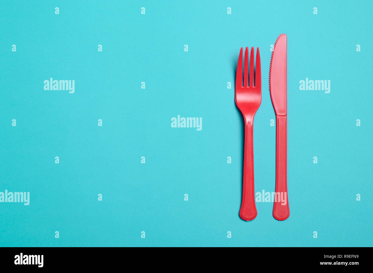 Red Fork and Knife on Bright Blue Background, Single Use Cutlery ...