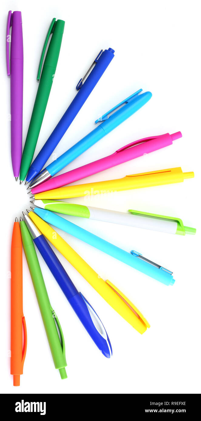 Multi colored ball pens on white background Stock Photo - Alamy