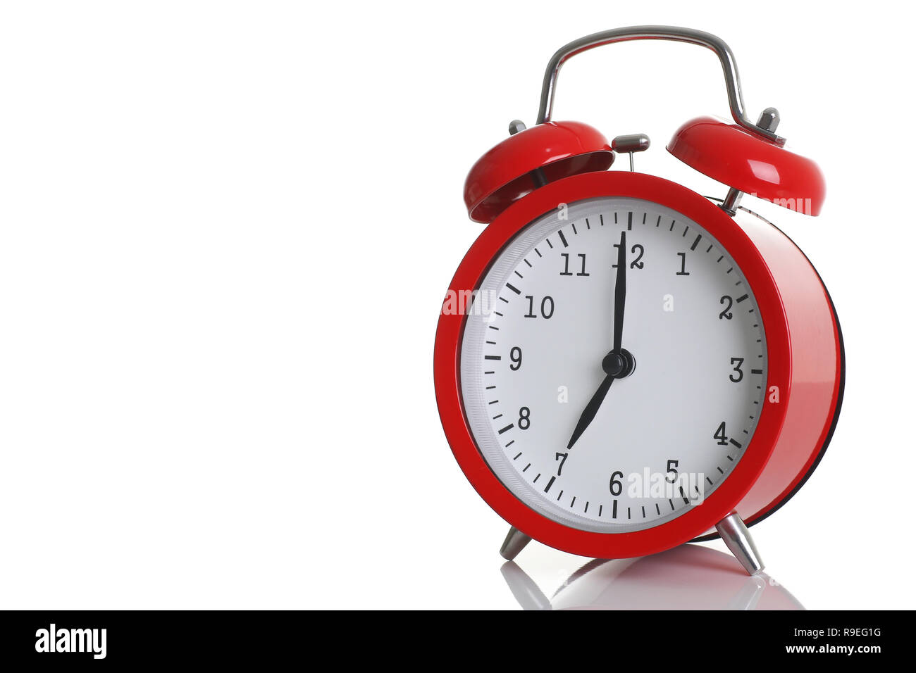 Red alarm clock isolated on white Stock Photo - Alamy