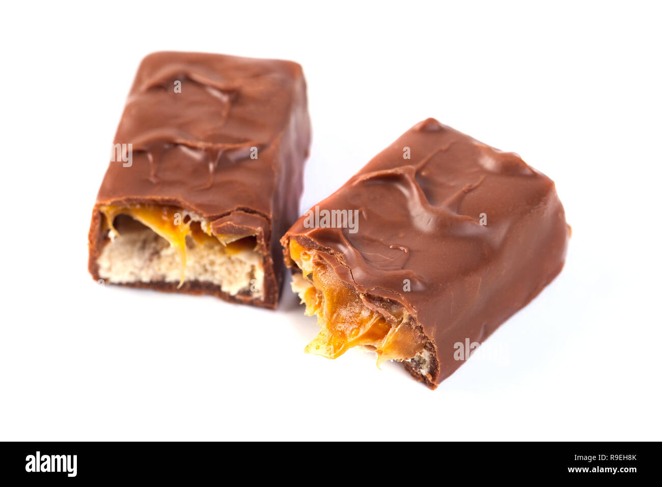 Chocolate bar with caramel isolated on white Stock Photo - Alamy