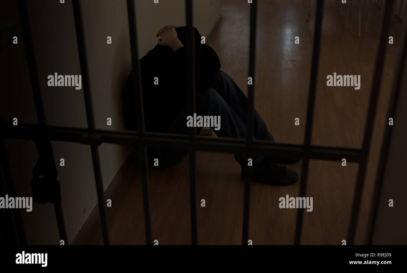 Criminal Behind Bars In Jail Stock Photos & Criminal Behind Bars In ...