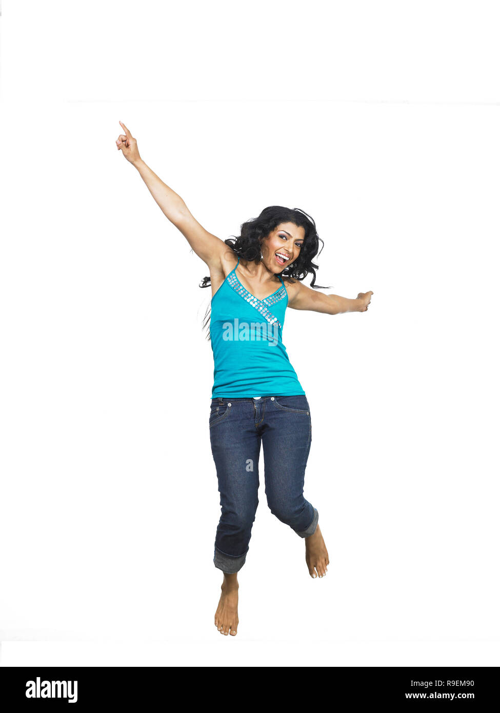 Excited woman jumping ocean Cut Out Stock Images & Pictures - Alamy