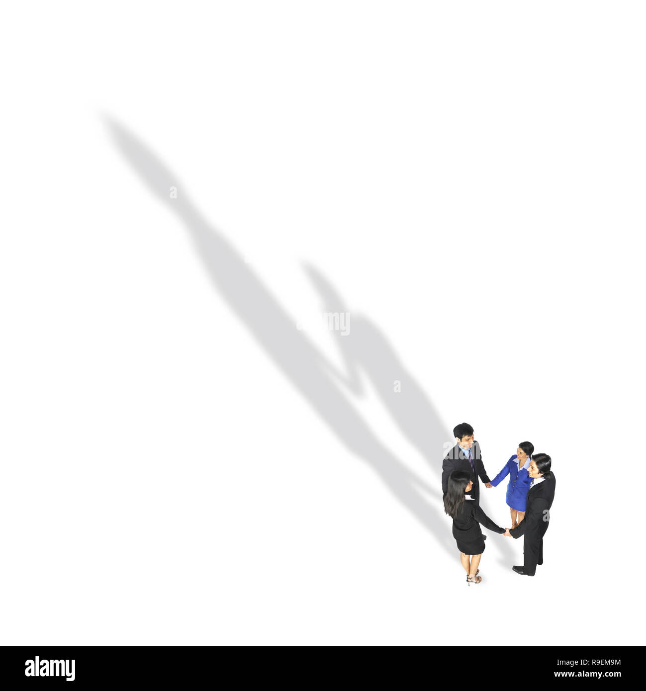 CORPORATE EXECUTIVES HOLDING HANDS AGAINST A WHITE BACKGROUND WITH LONG ...