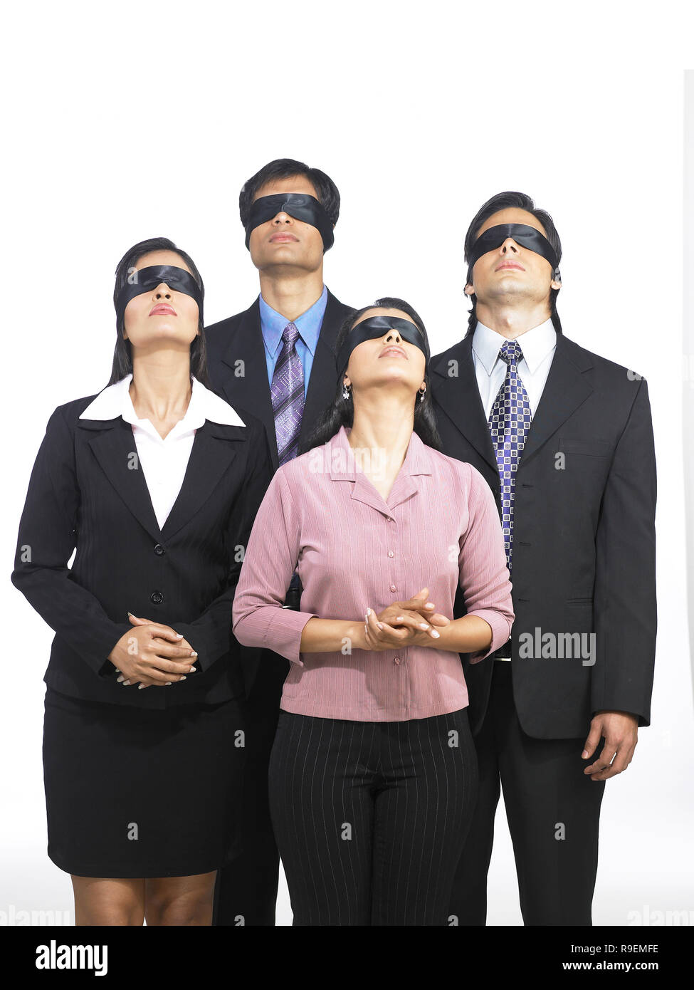 PORTRAIT OF FOUR CORPORATE EXECUTIVES BLINDFOLDED Stock Photo - Alamy