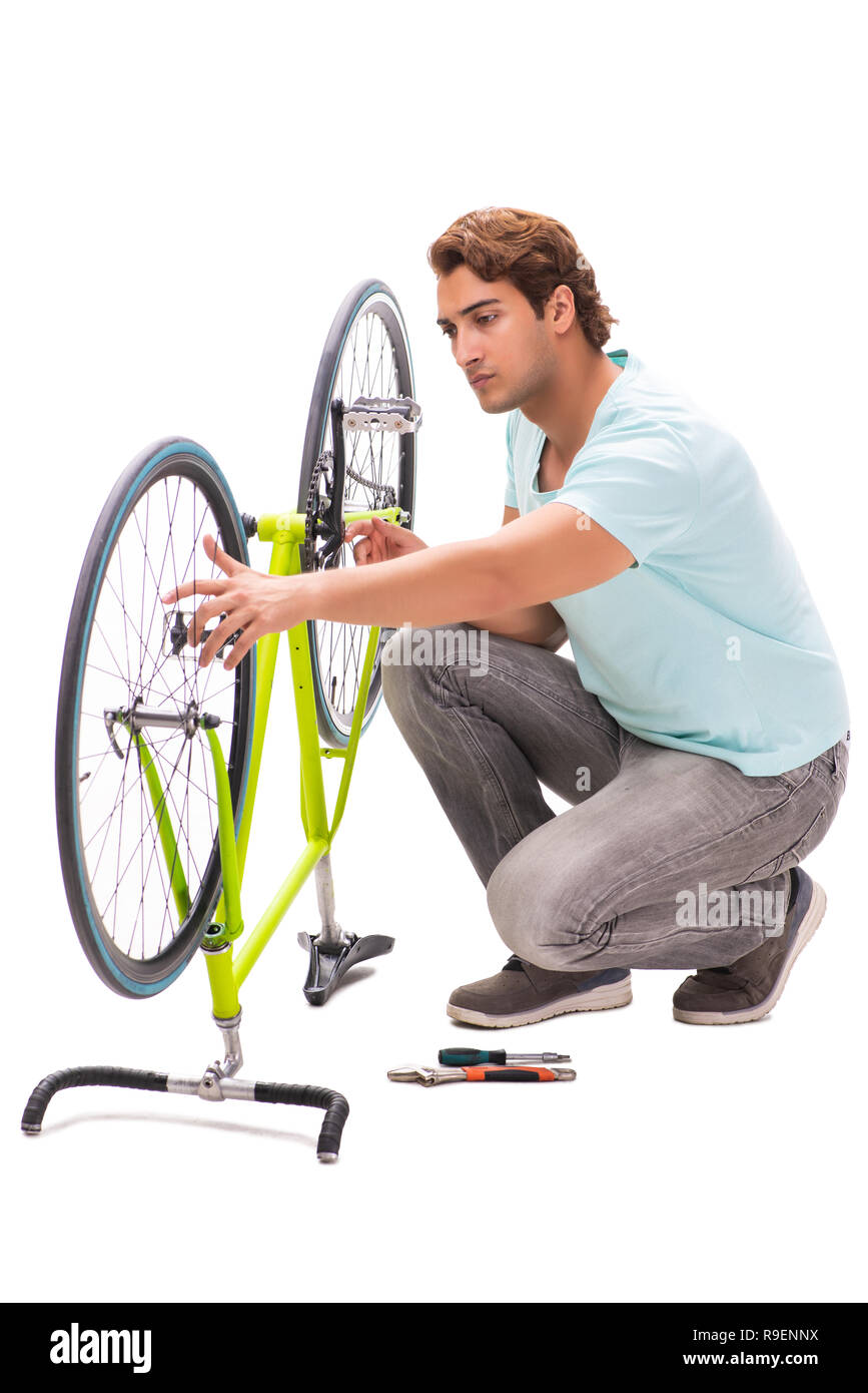Man repairing his bike isolated on white background Stock Photo - Alamy