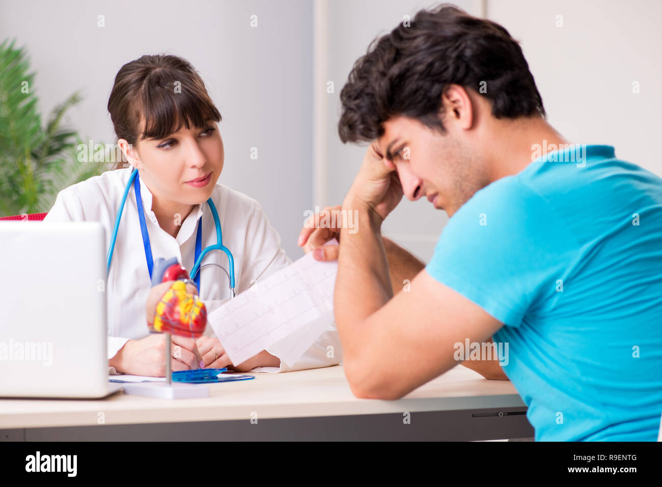 Young patient visiting doctor cardiologist Stock Photo - Alamy