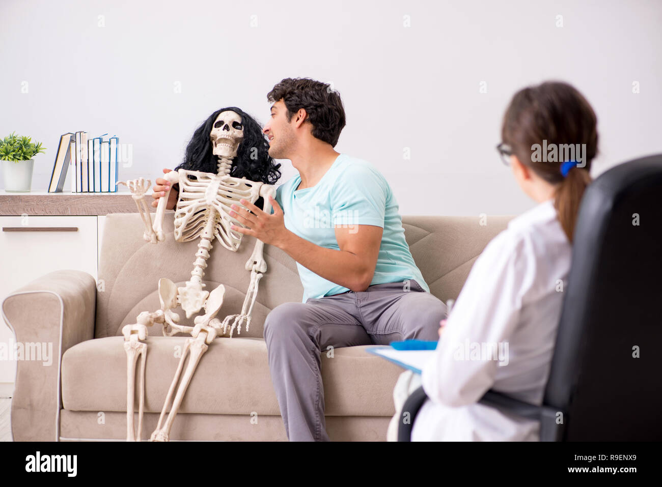 Young patient visiting psychologist for therapy Stock Photo - Alamy