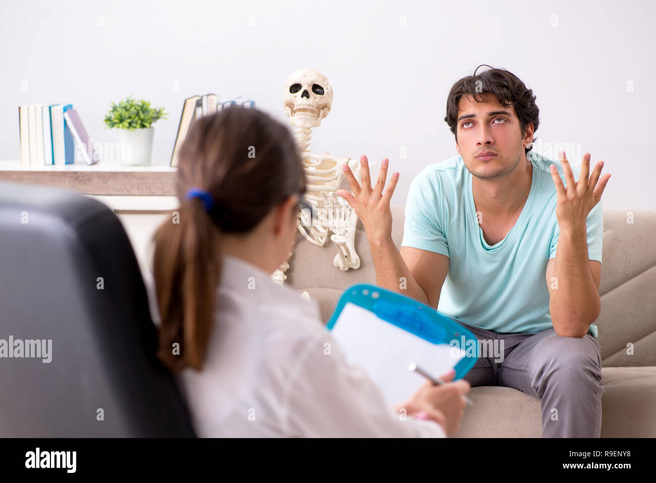 Young patient visiting psychologist for therapy Stock Photo - Alamy