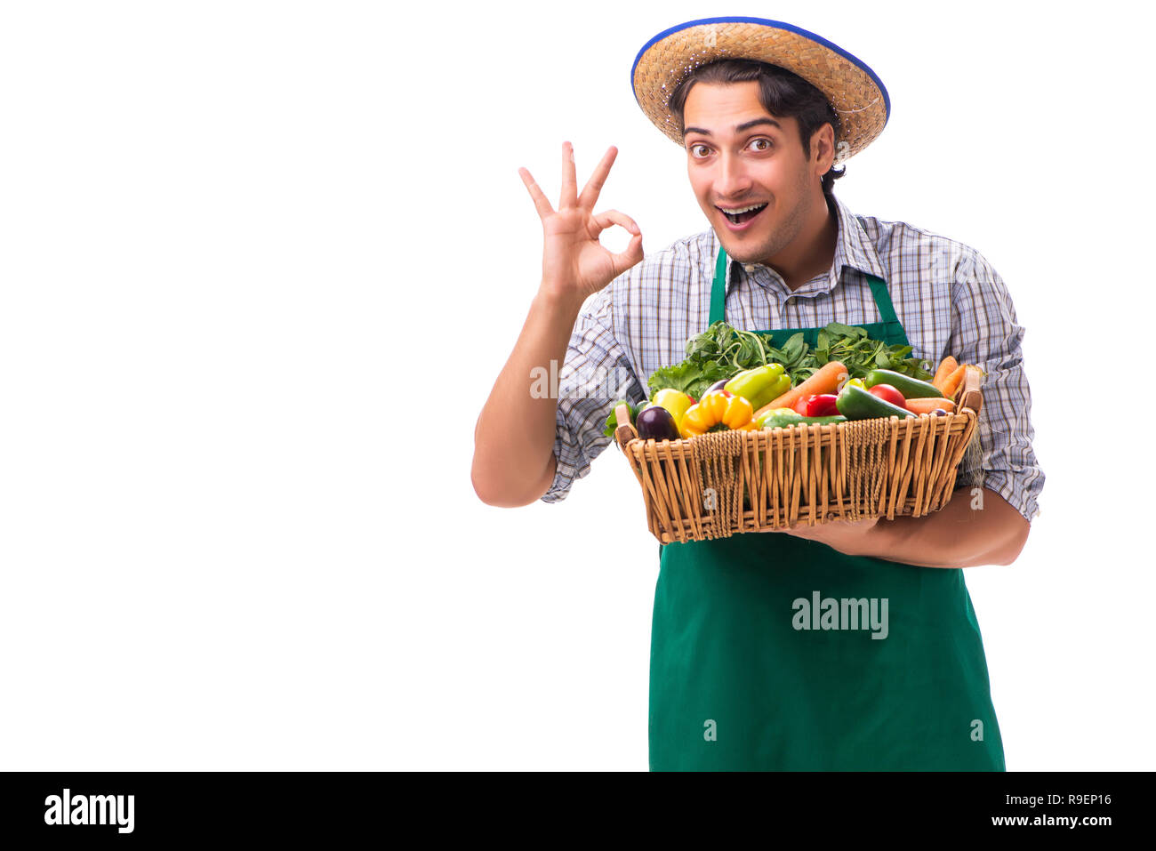Young farmer with fresh produce isolated on white background Stock ...