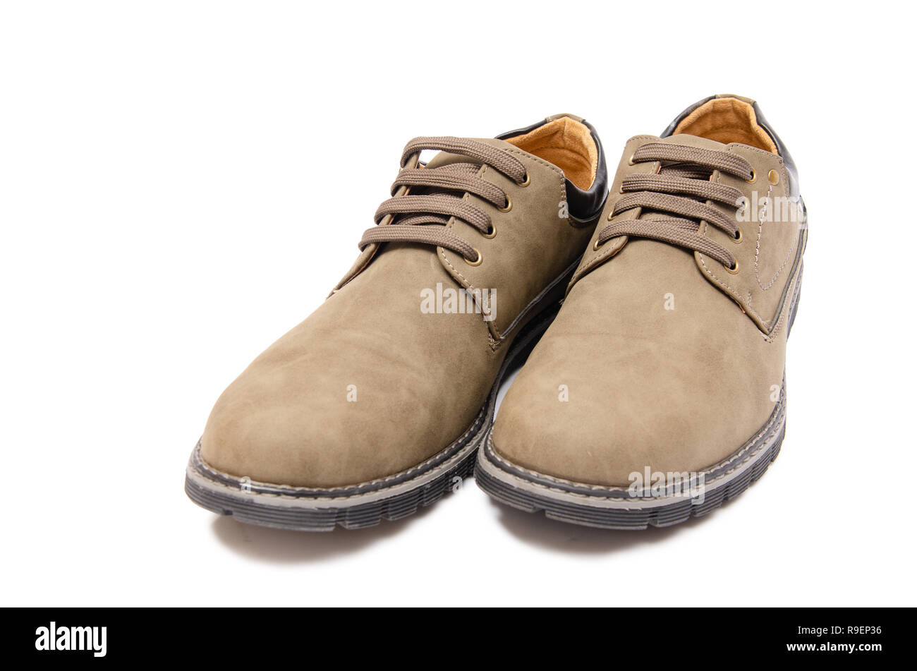 Brown suade shoes isolated on white background Stock Photo - Alamy