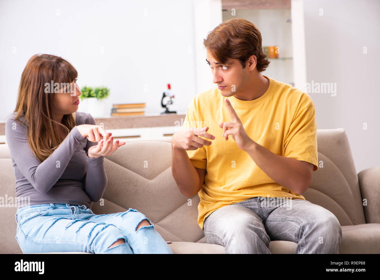 Woman and man learning sign language Stock Photo - Alamy