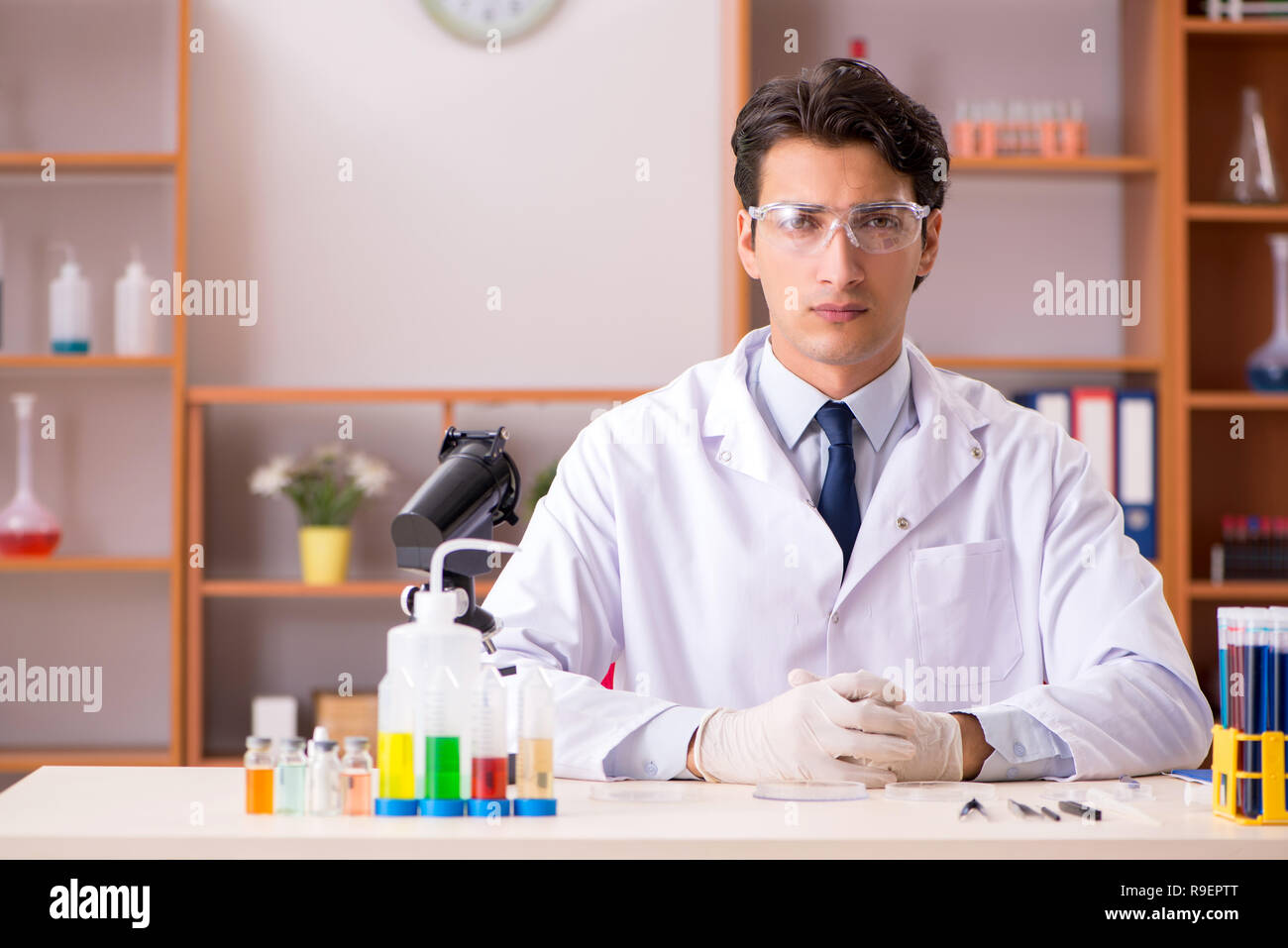 Young biochemist working in the lab Stock Photo - Alamy