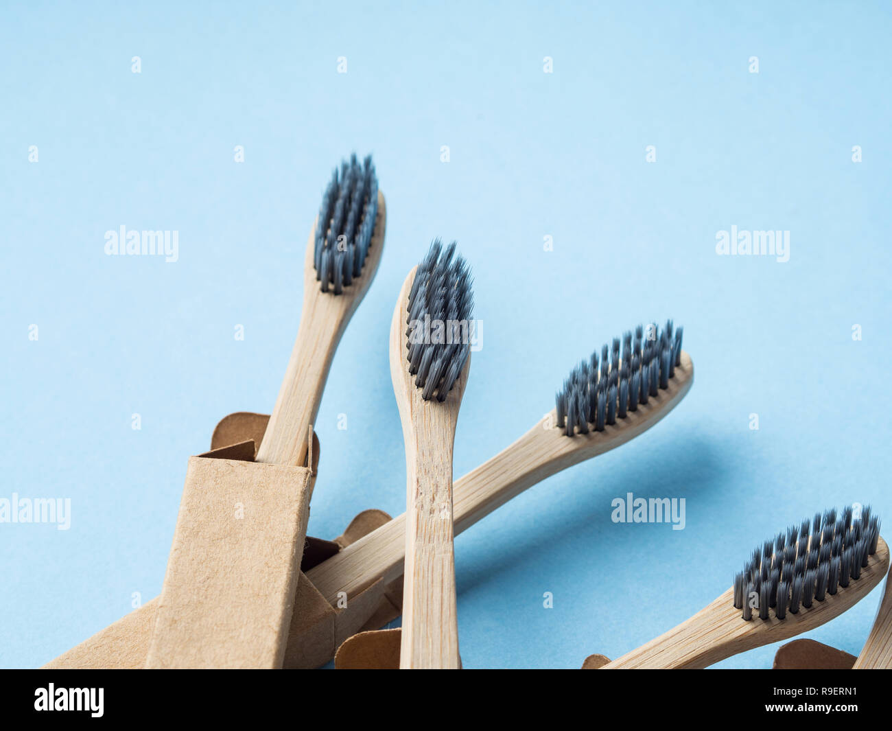 Bamboo biodegradable toothbrushes on blue with eco friendly cardboard ...