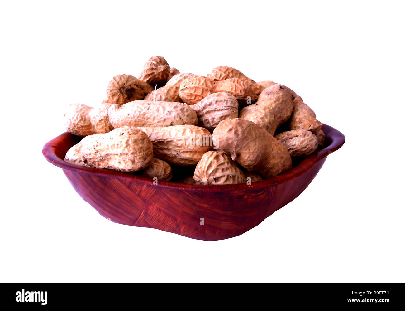Peanuts in a plate on a white background Stock Photo - Alamy