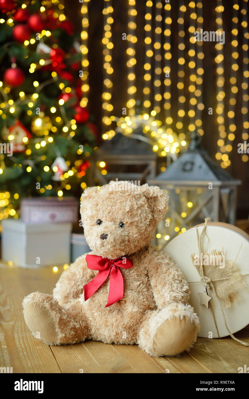Teddy bears siting under the christmas tree with presents. Holiday ...