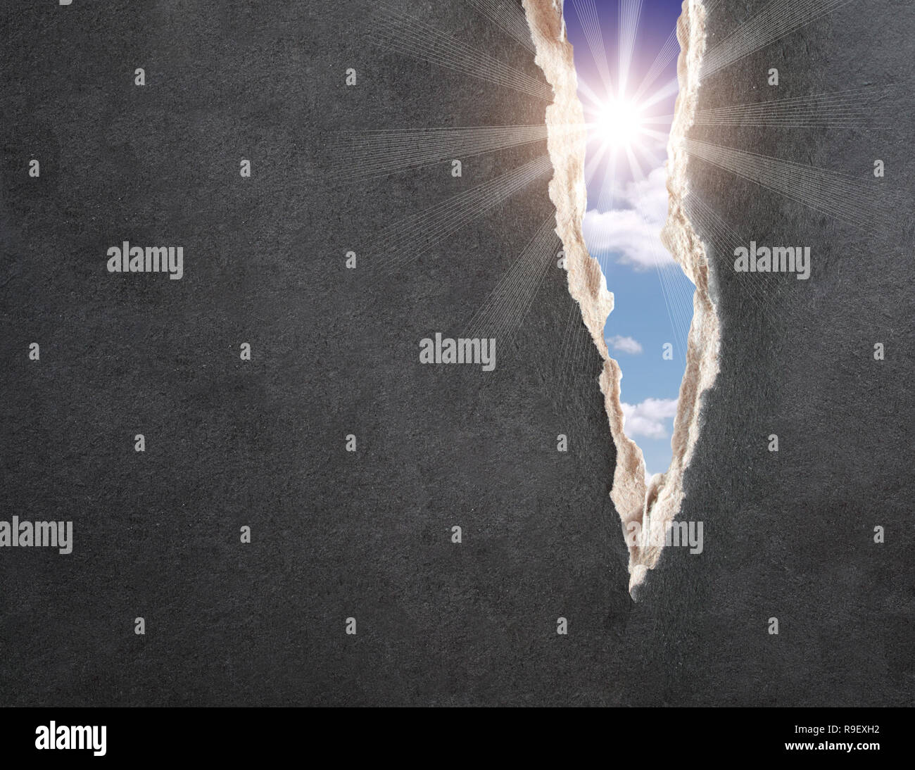 Sun and blue sky in hole with the fragmentary edges Stock Photo - Alamy