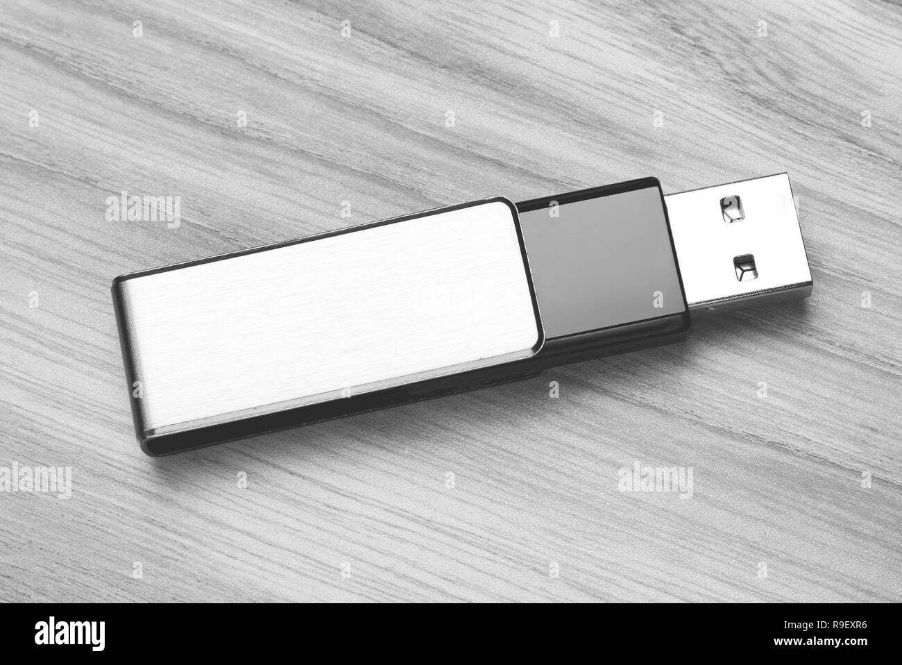Flash memory drive on wooden desk background Stock Photo - Alamy