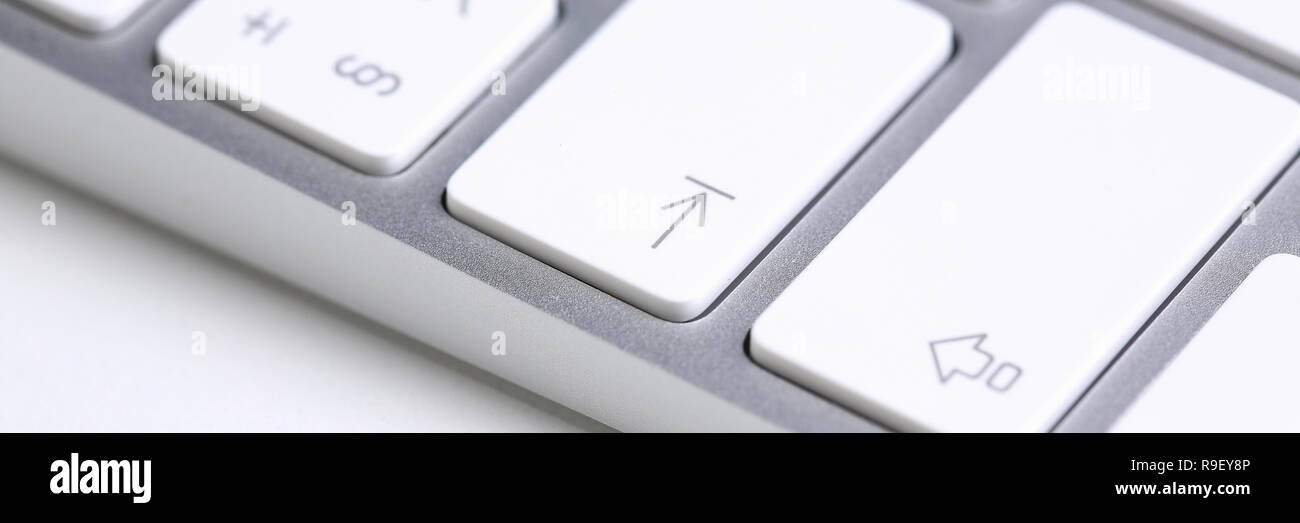 Silver keyboard with white key push button Stock Photo - Alamy