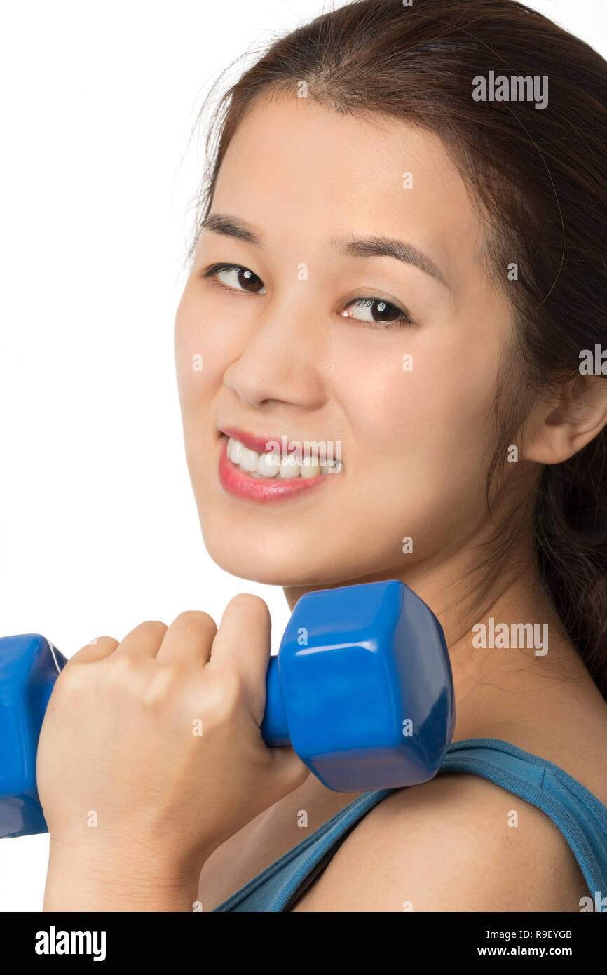 Beautiful Asian woman working out using dumbbell weights isolated on a ...