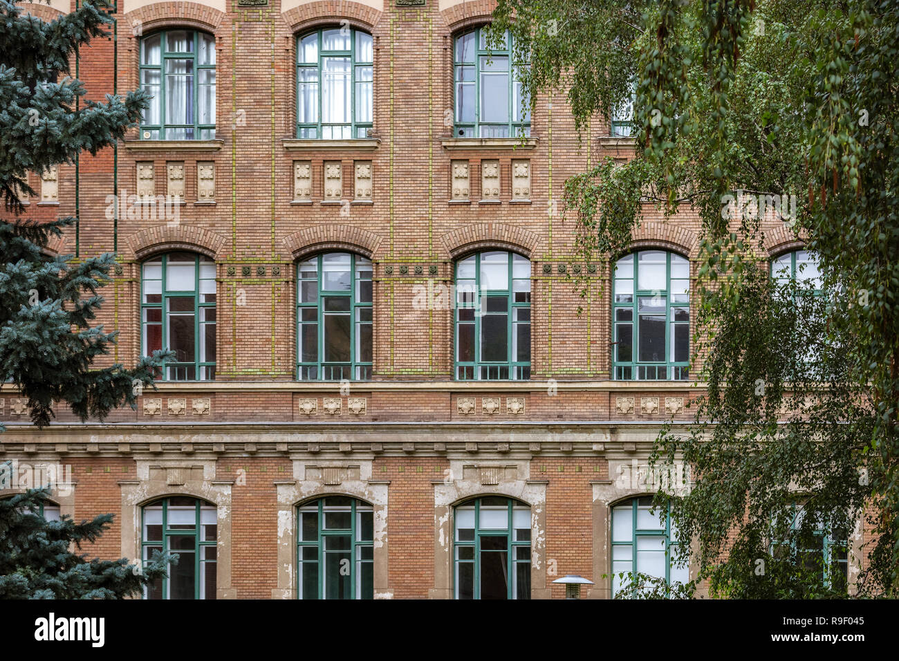 Arched windows located on the brick wall of the campus of the Budapest ...