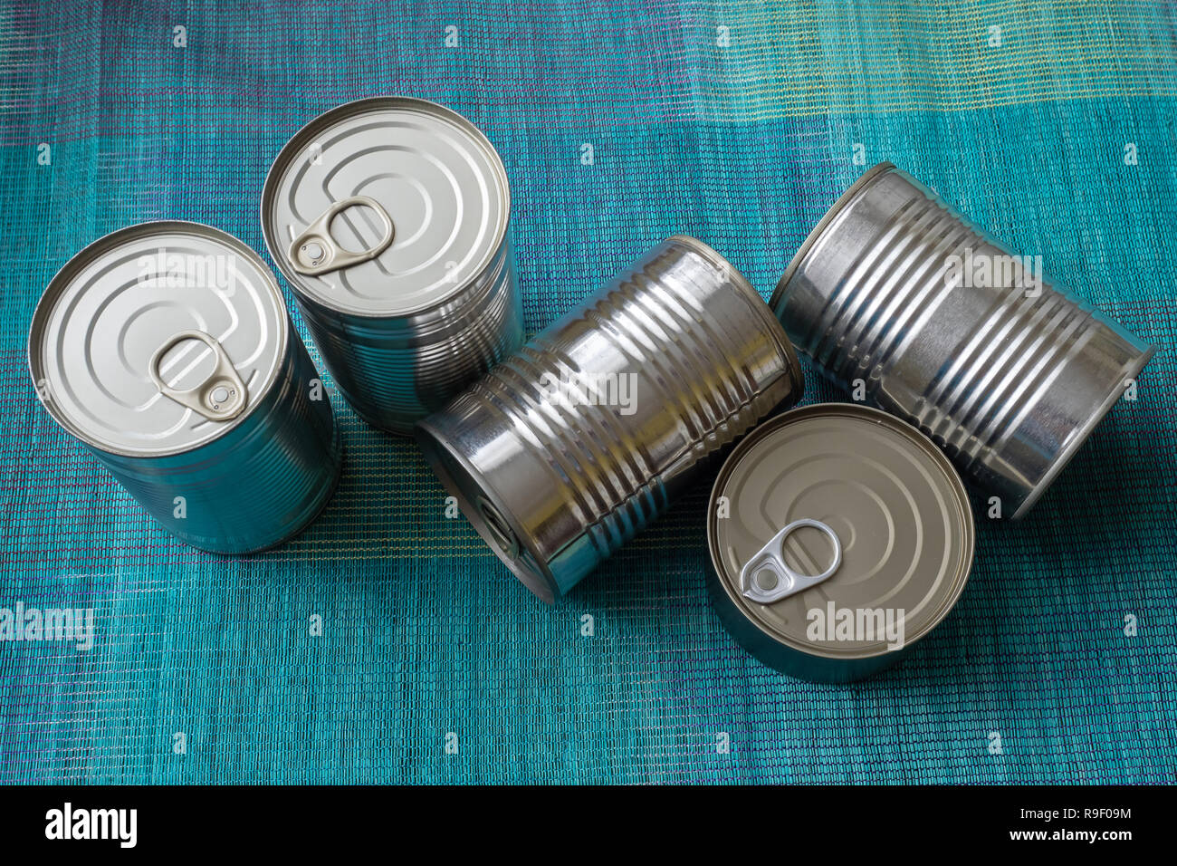 Tin cans with food. Conserved food. Closeup of a group of aluminium ...