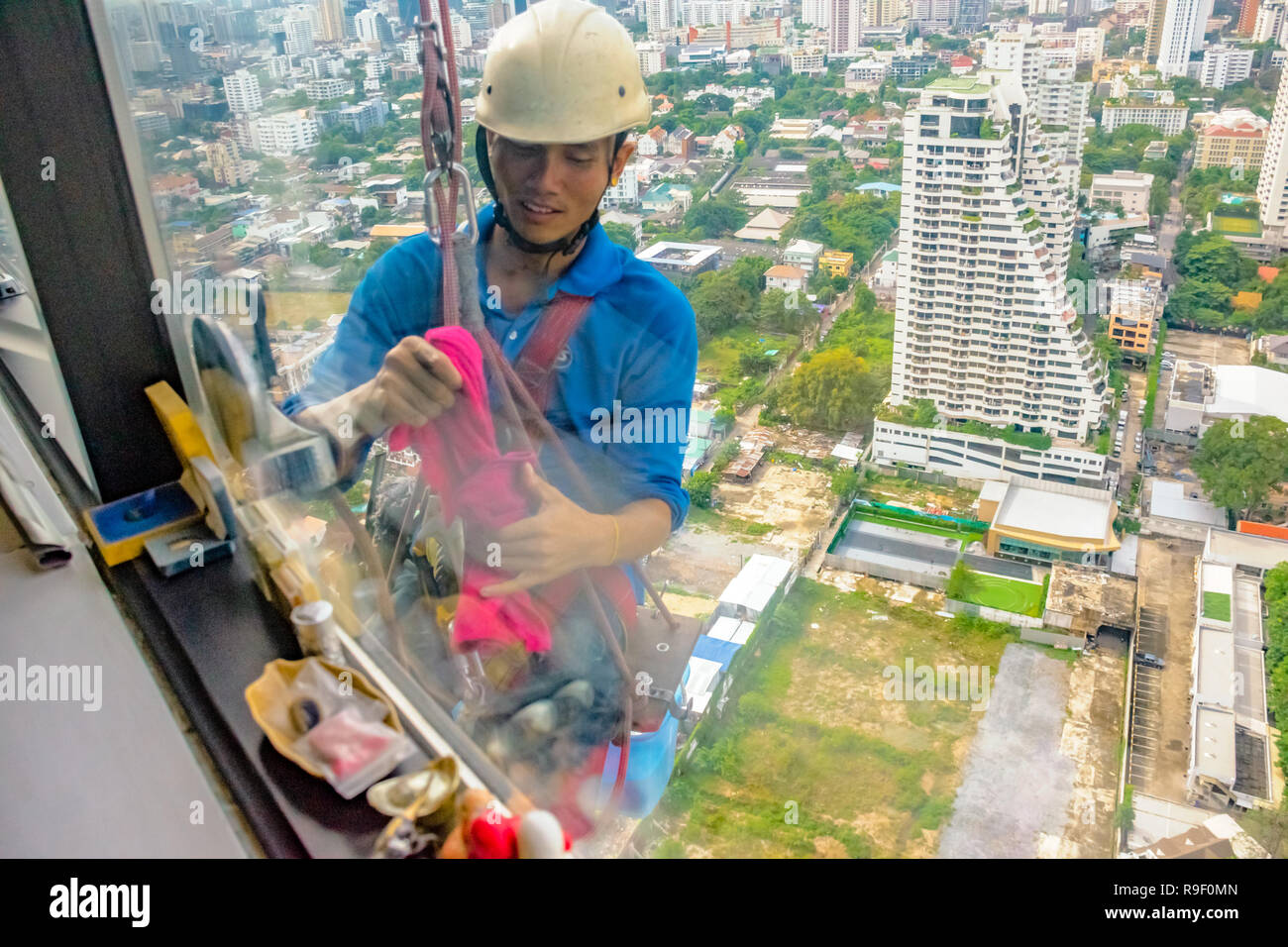 Bangkok, Thailand - December 13, 2018: A daring profession. A window ...