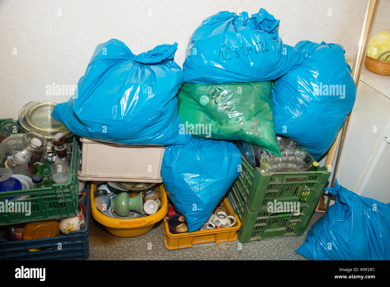 Cartons and trash bags in a room Stock Photo - Alamy