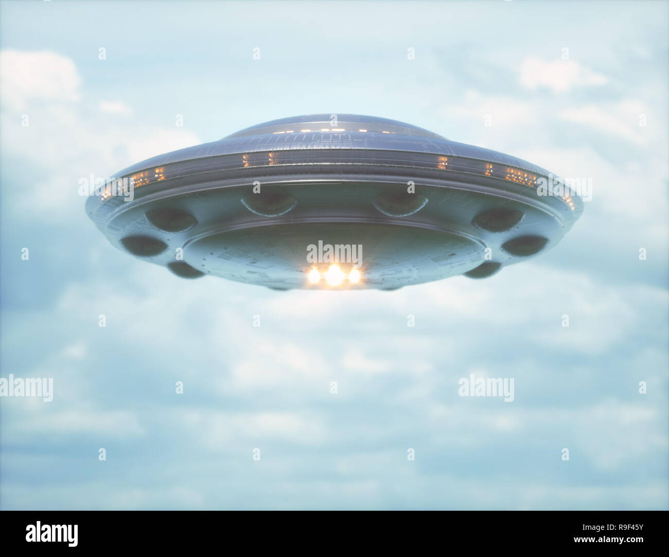 Unidentified flying object in cloudy sky with strong lights pointed ...