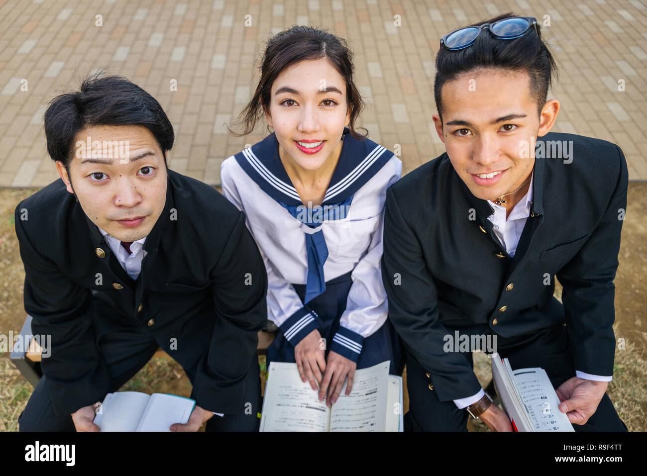 Yung japanese students with school uniform bonding outdoors - Group of asian teenagers having ...