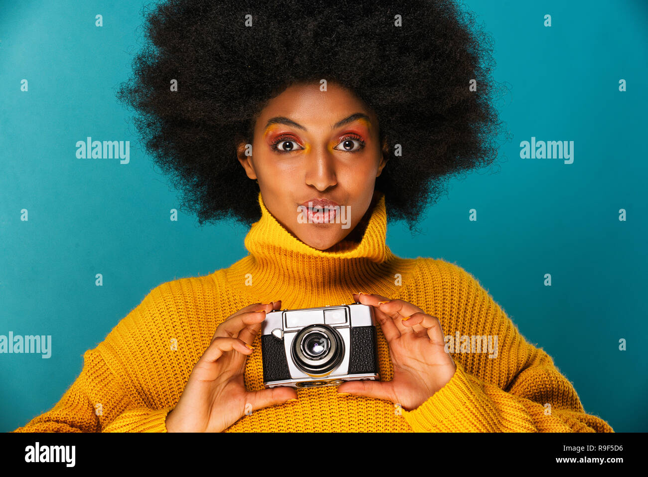 Portrait of pretty afro american woman in a studio for a beauty session ...